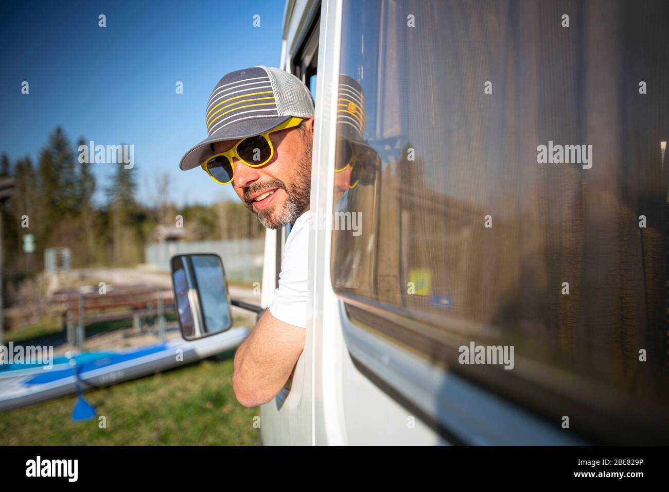 Portrait of careless man during holidays camping in his van Stock Photo ...