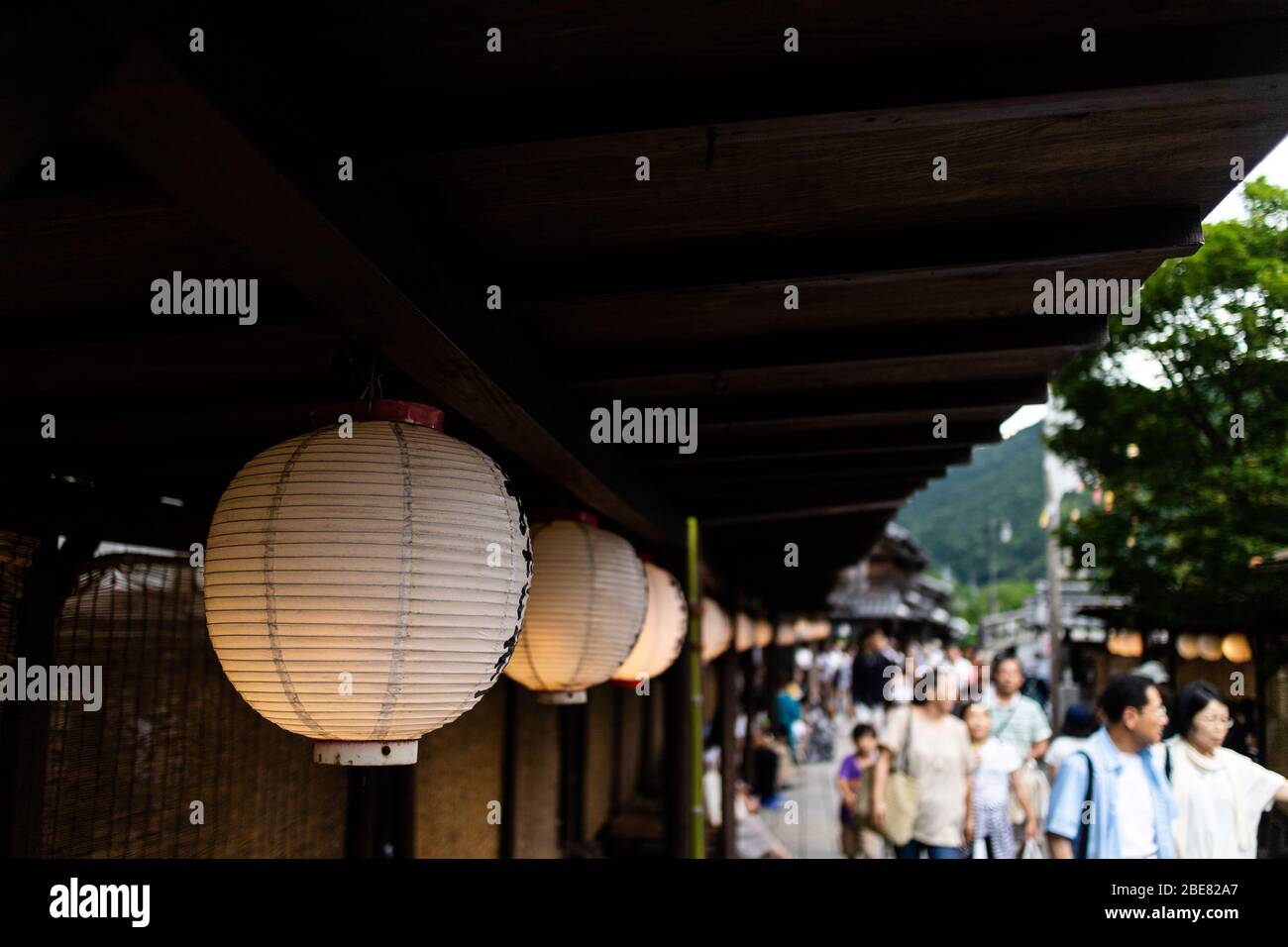 traditional lanterns hung alongside a busy street Stock Photo - Alamy