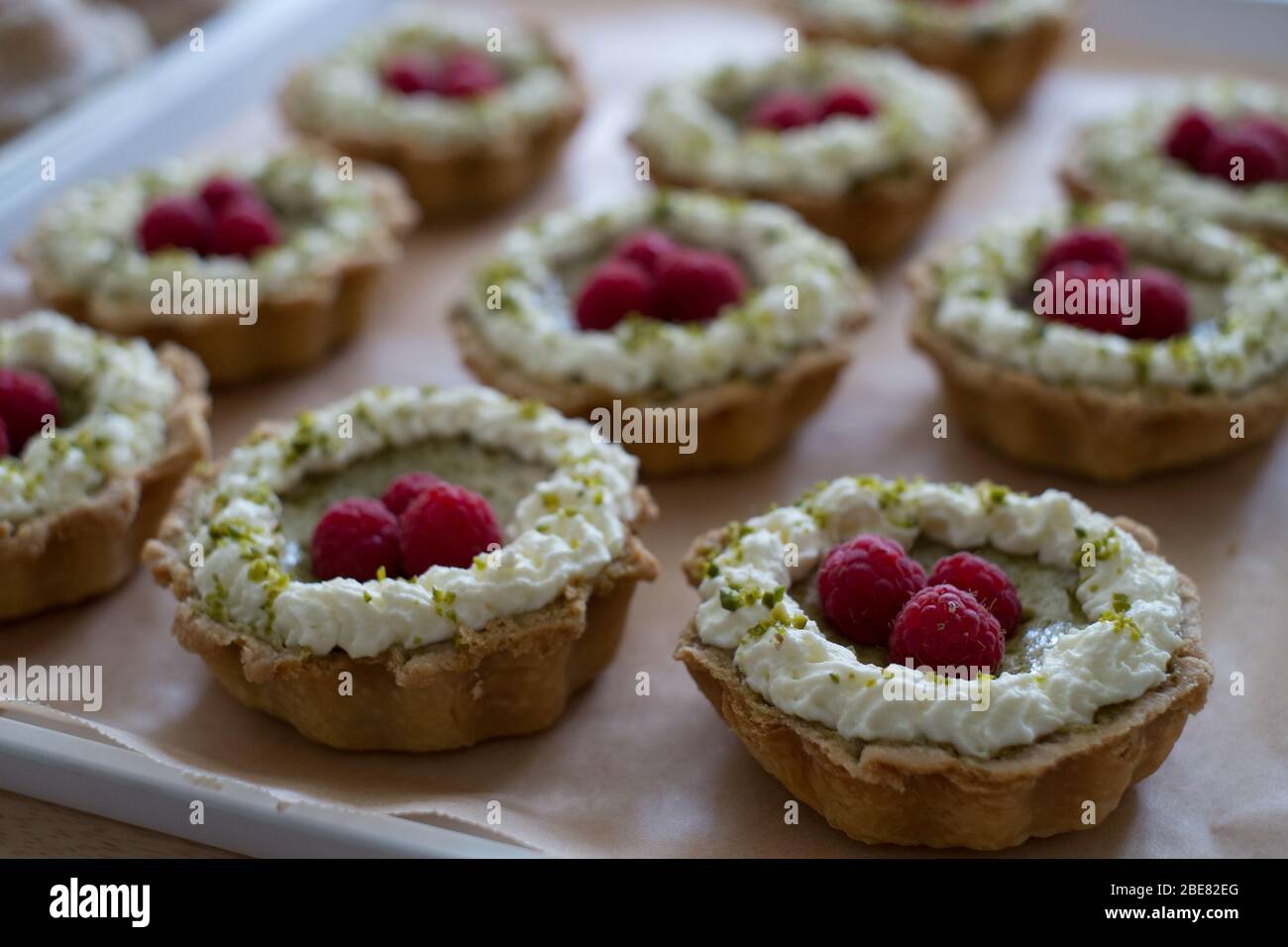 Raspberry and pistachio frangipane tarts, made by Scotland-based ...