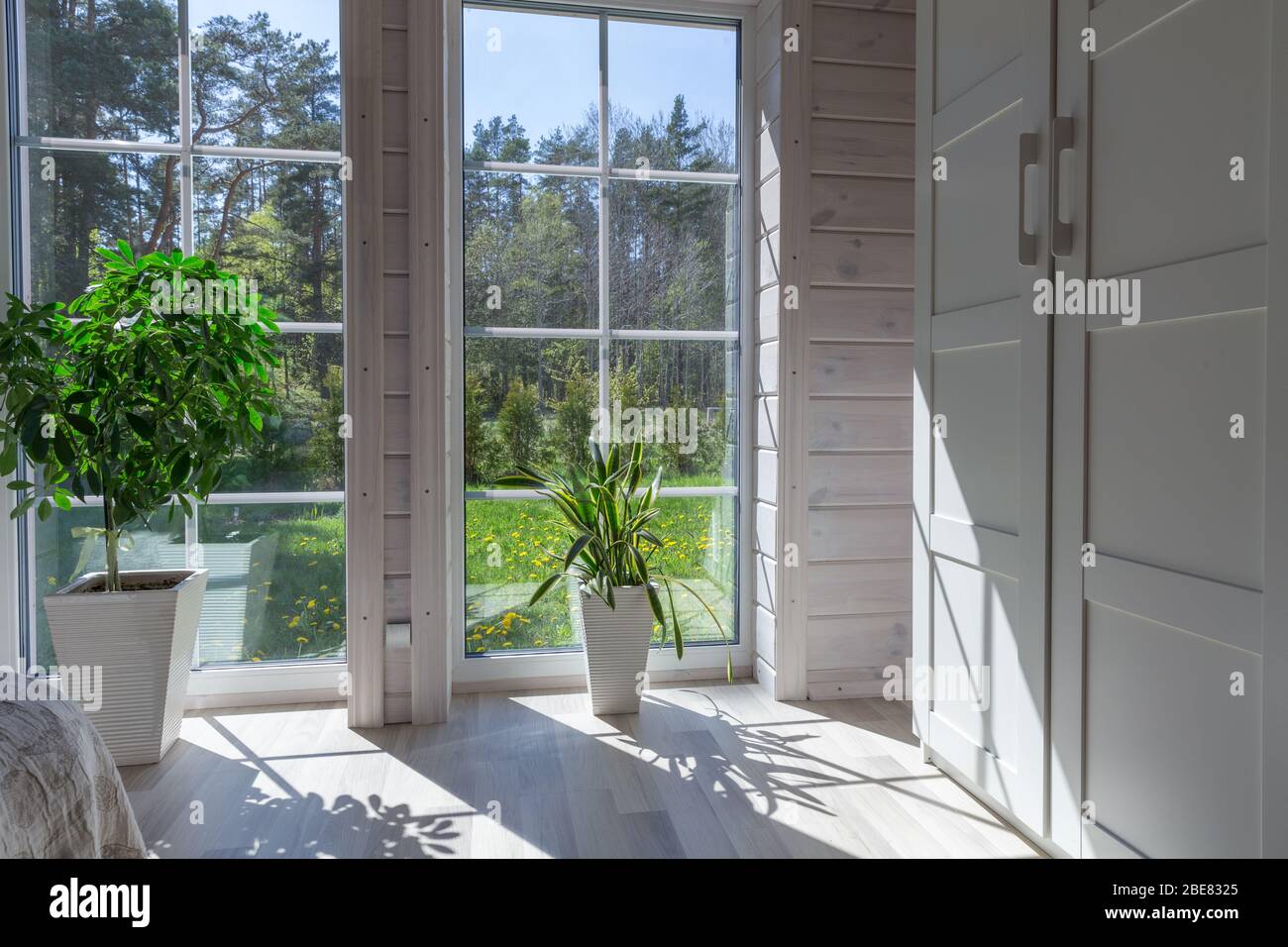 Bright photo studio interior with big window, high ceiling, white ...