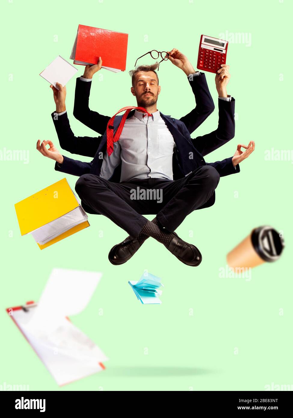 Young caucasian businessman, manager who manages everything, a lot of ...