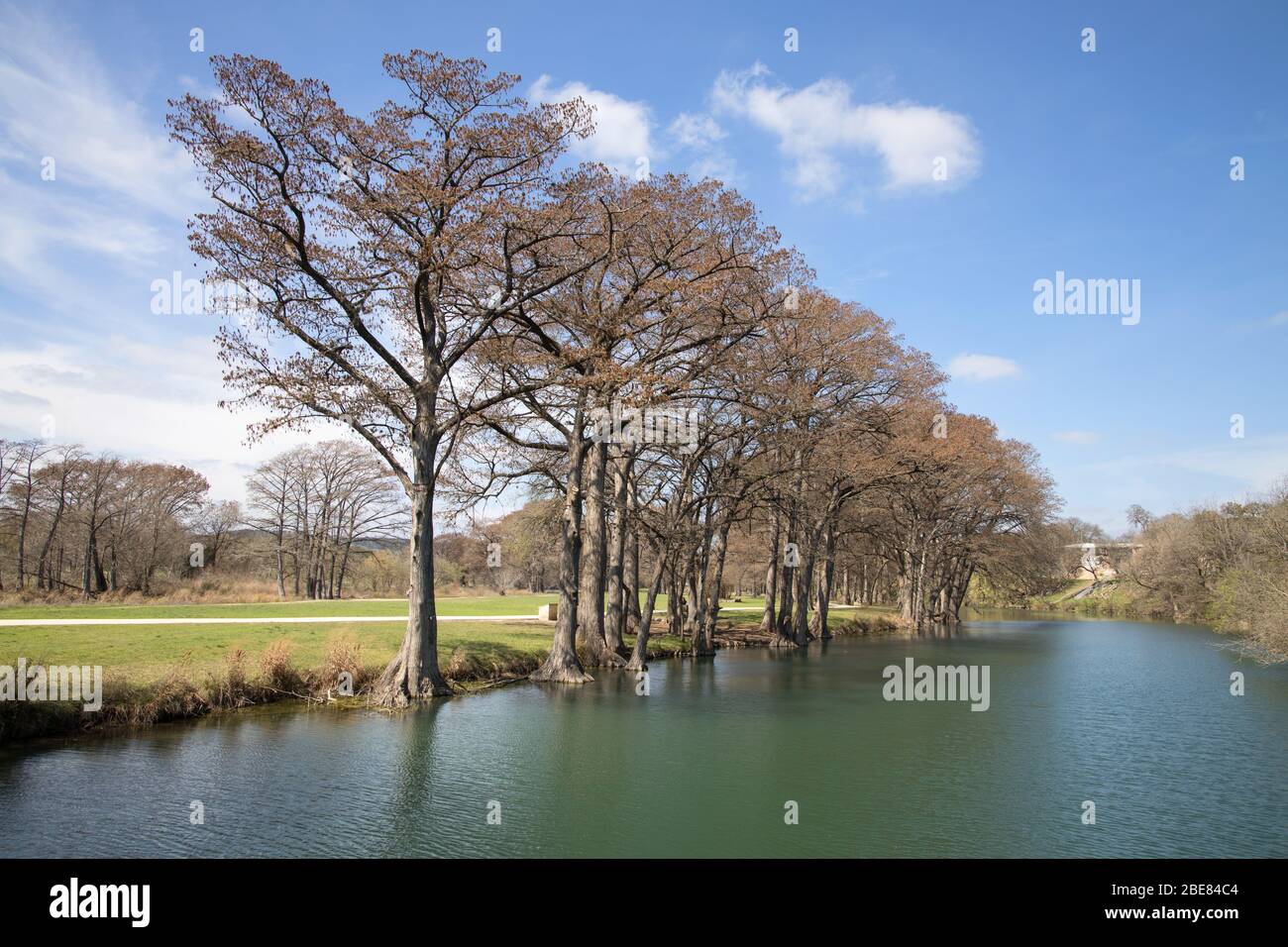 river trail along the guadalupe river in the small hill country town of ...