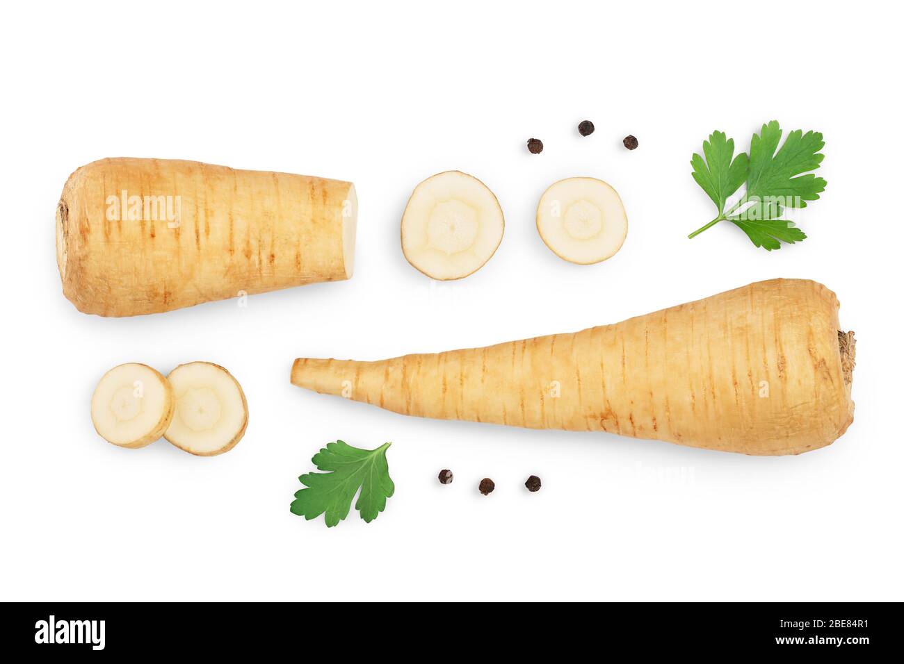 Parsnip root and slices with parsley peppercorns isolated on white ...