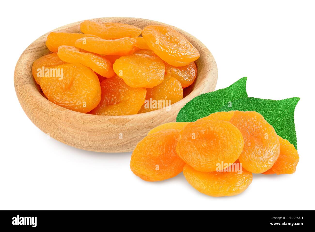 Dried apricots in wooden bowl isolated on white background with full ...