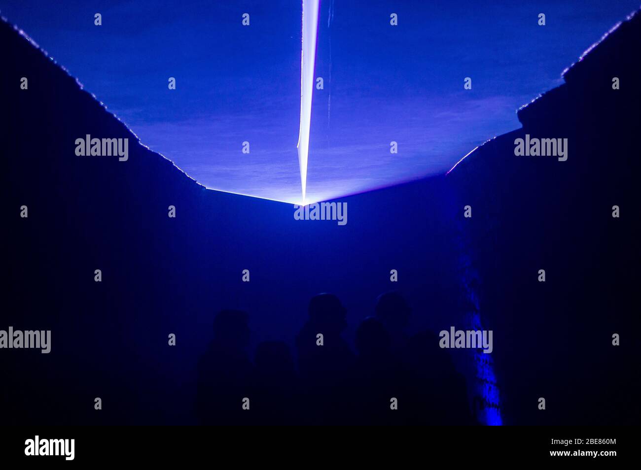 fanned out blue laser beam in smoke Stock Photo - Alamy