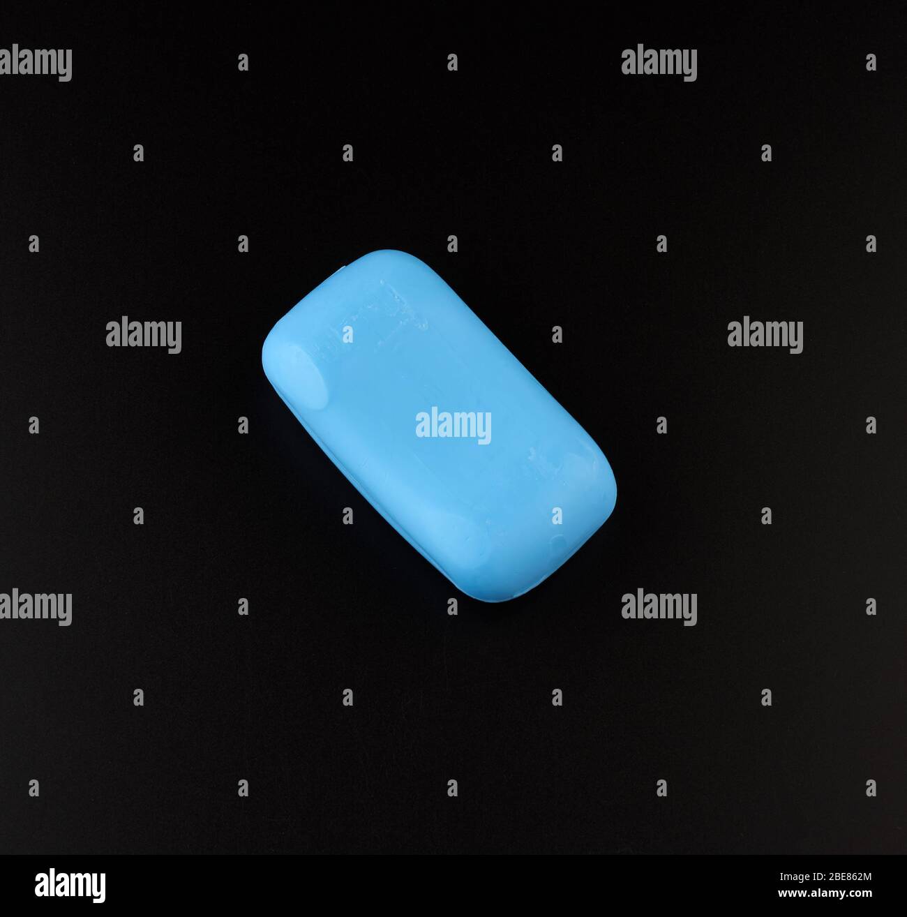 blue soap on a black background, top view, concept of cleanliness ...