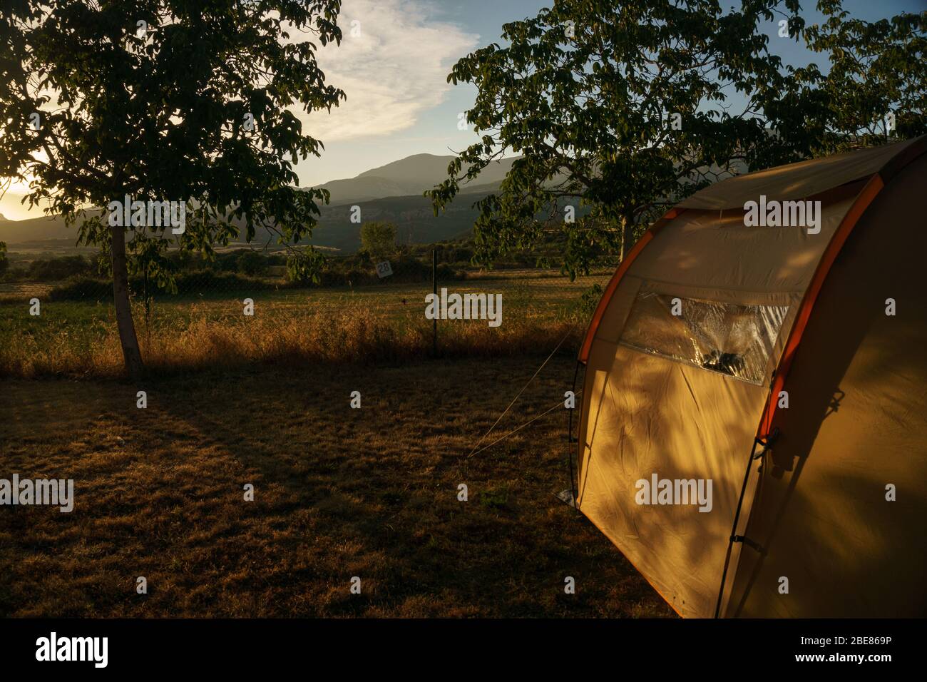 Landscape of a tent in a camping. Sunset lighting Stock Photo - Alamy