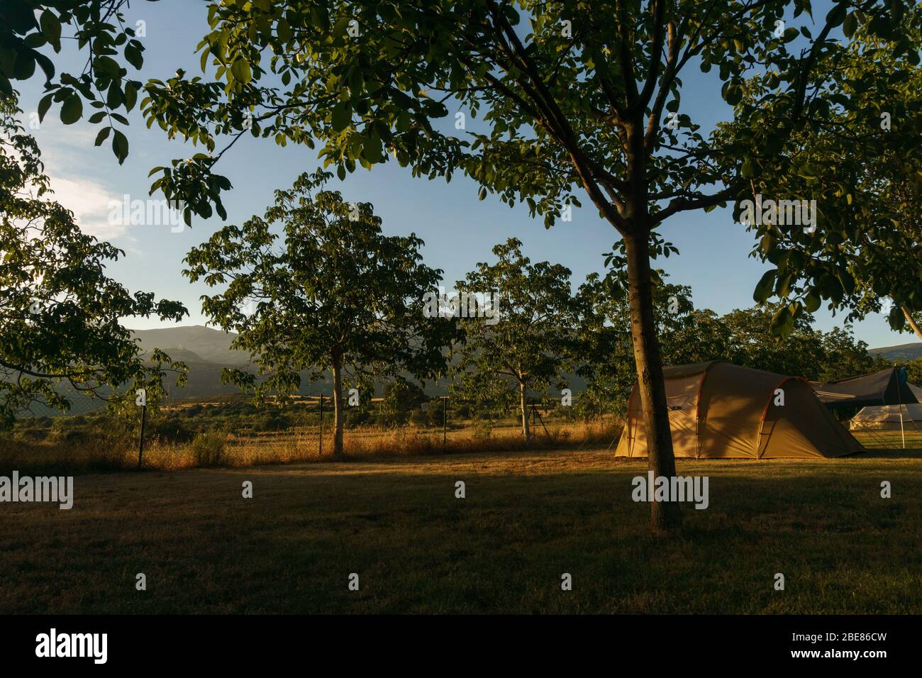 Landscape of a tent in a camping. Sunset lighting Stock Photo - Alamy