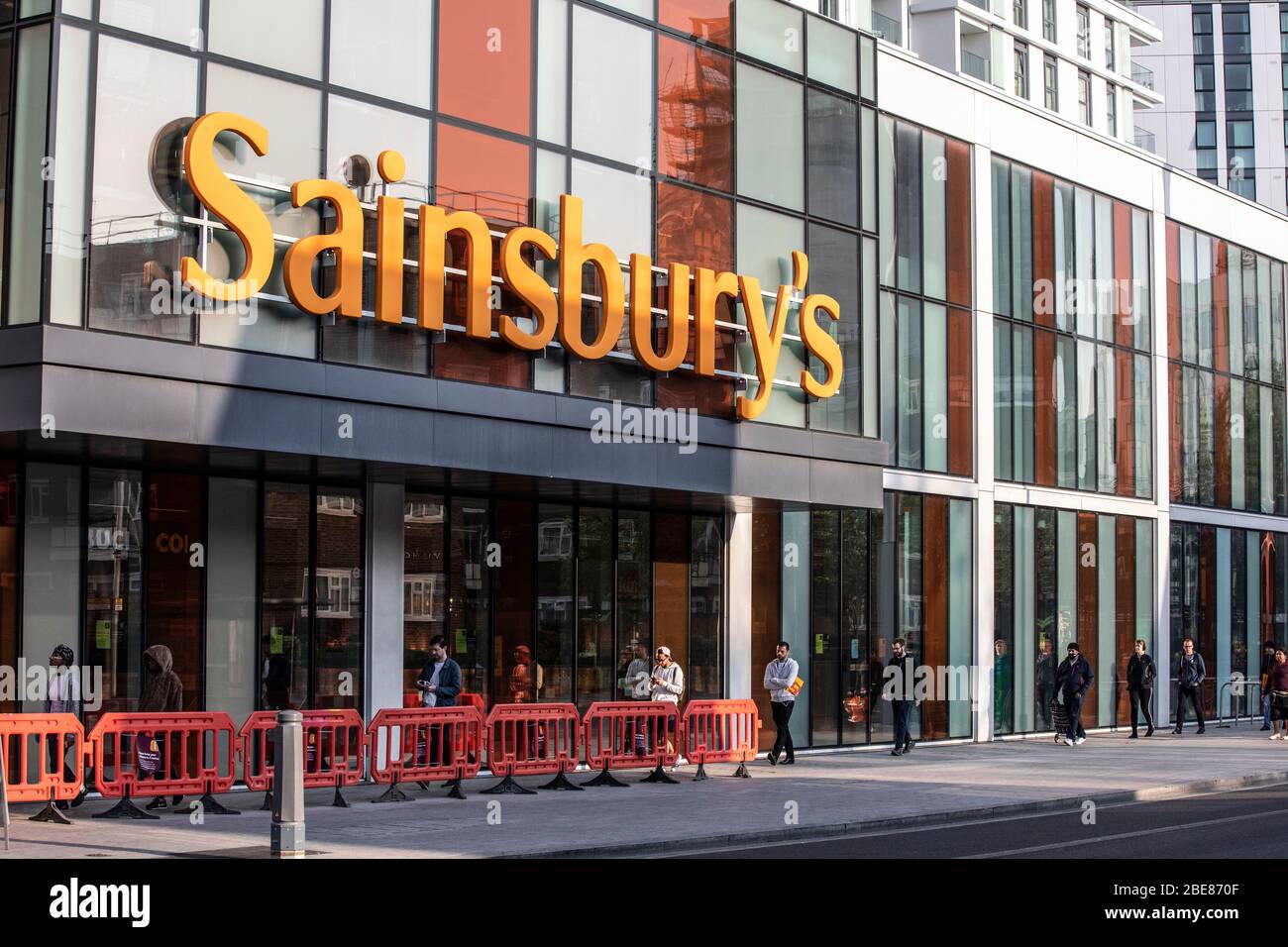 Queues of shoppers line up outside a Sainsbury's superstore in Vauxhall ...