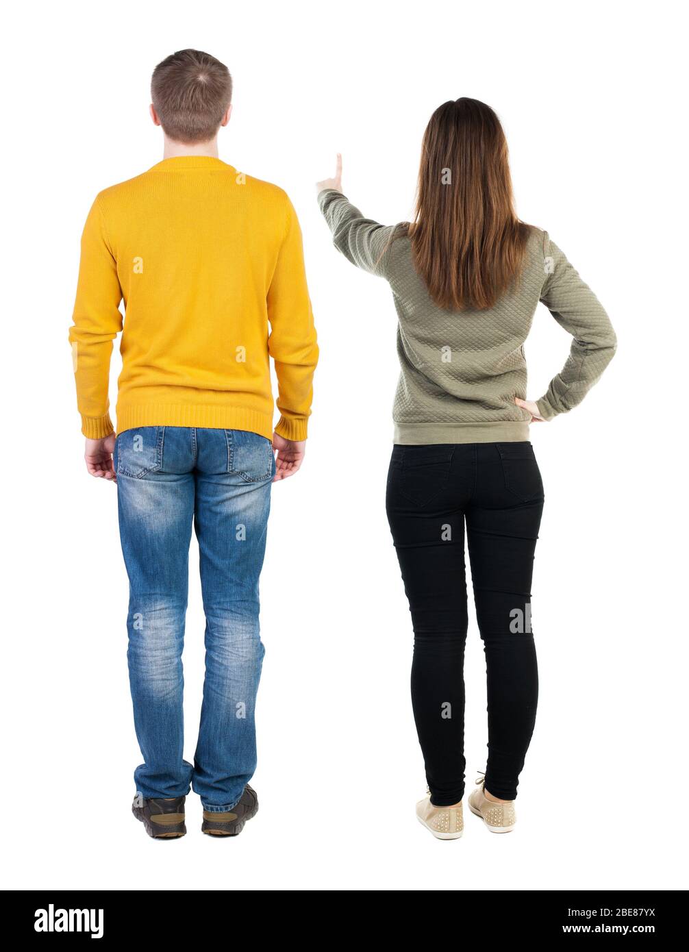 Back view of couple in sweater pointing. Rear view people collection ...