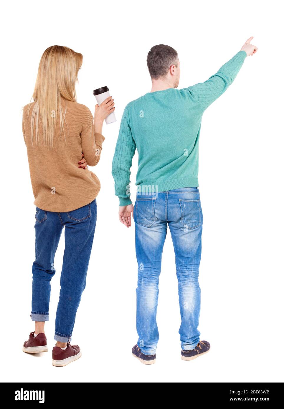 Back view of couple in sweater pointing. Rear view people collection ...