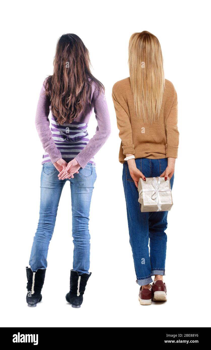Back view of two woman in sweater. Rear view people collection ...