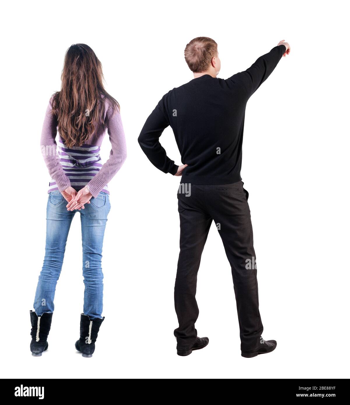 Back view of couple in sweater pointing. Rear view people collection ...