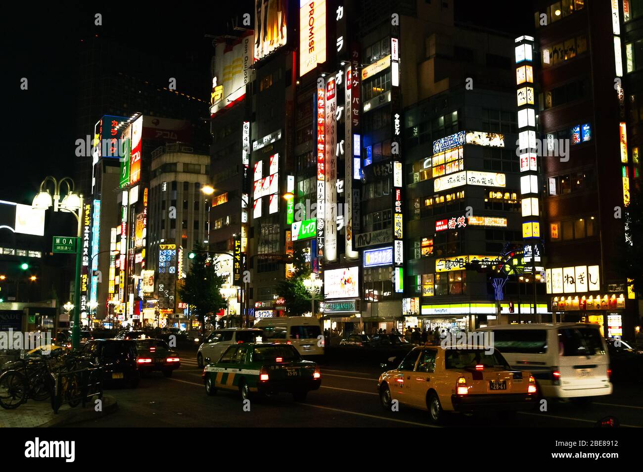 Night time Street scene showing the neon lighting of the Shinjuku ...