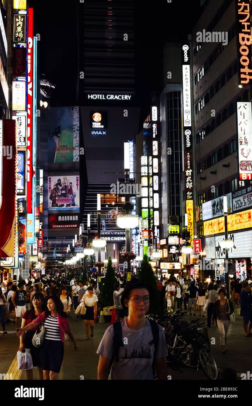 Night time Street scene showing the neon lighting of the Shinjuku ...