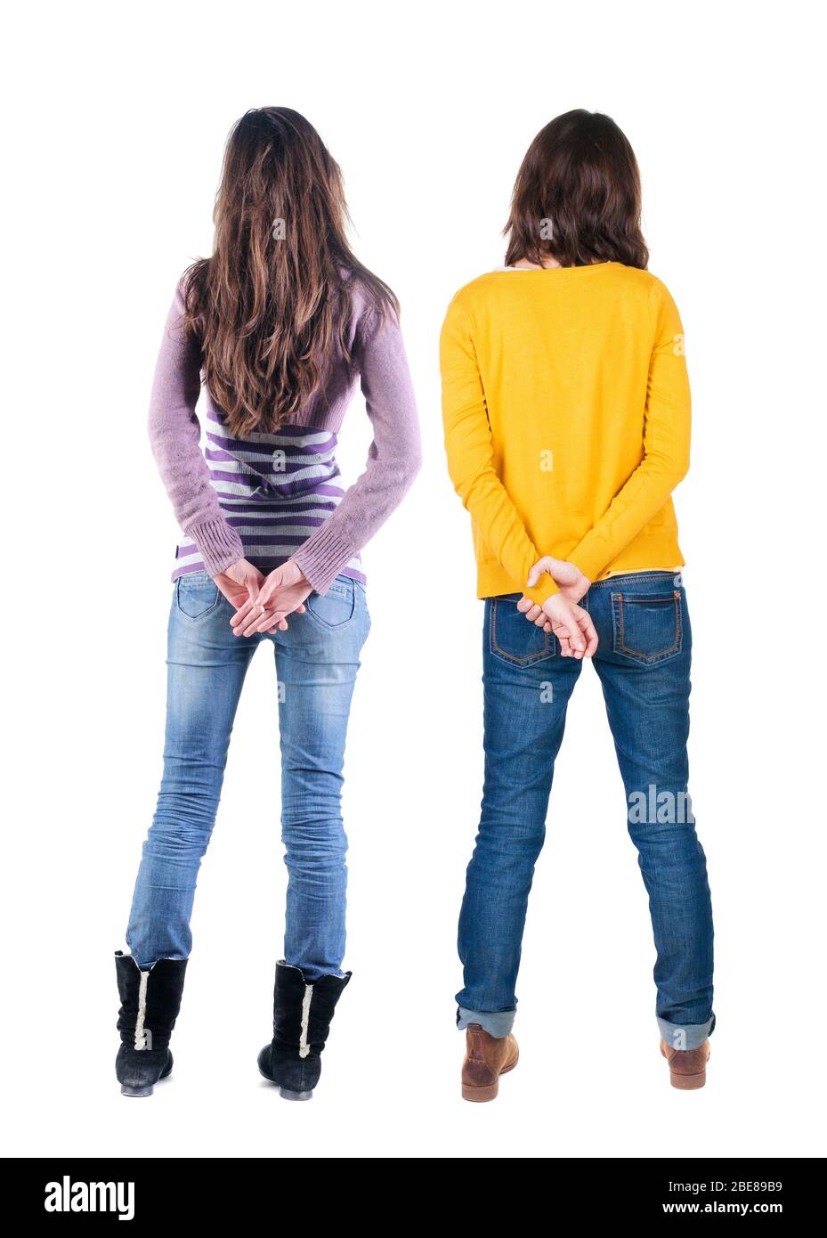 Back view of two woman in sweater. Rear view people collection ...