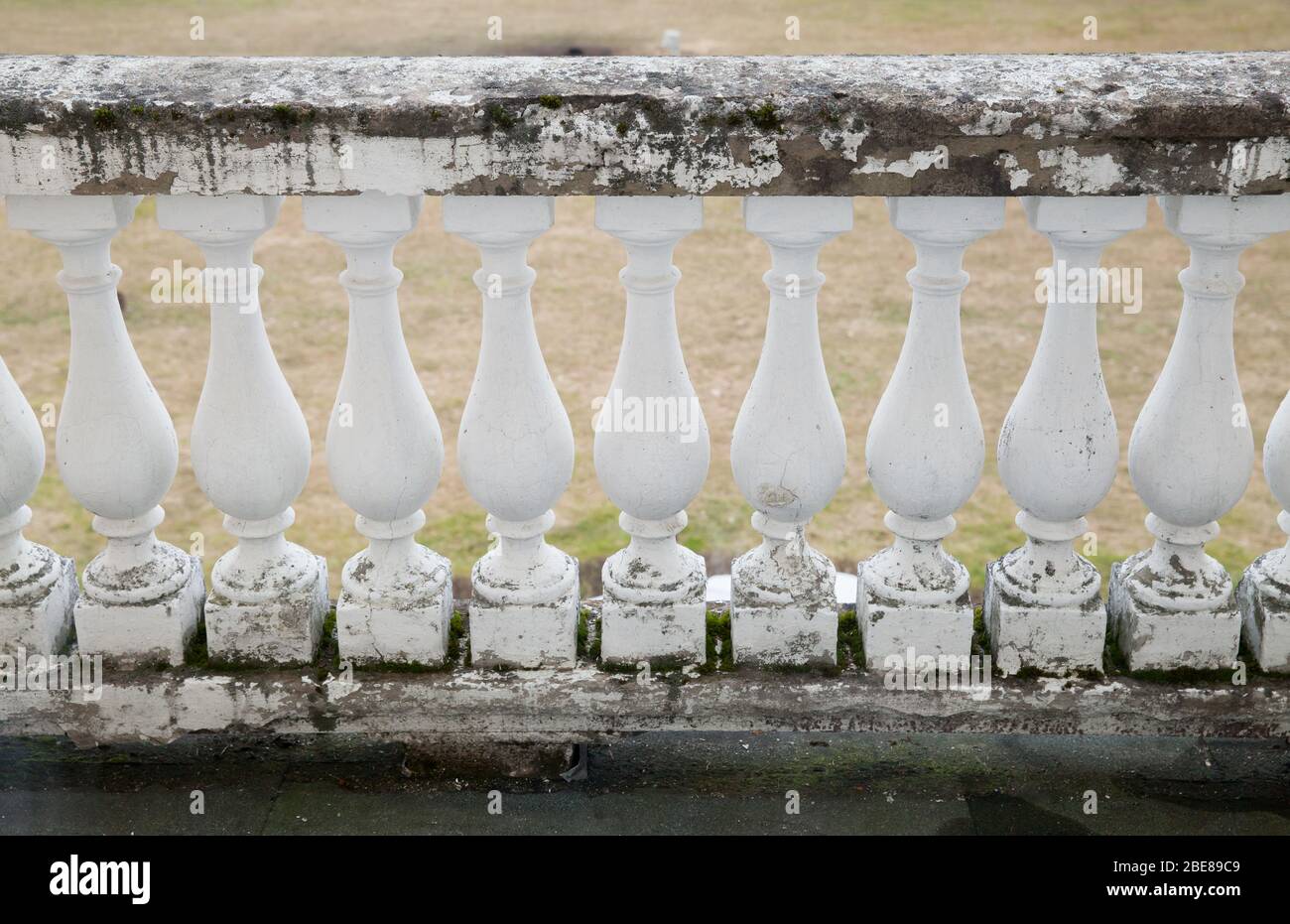 Old terrace balusters made of painted concrete. Abstract classical ...