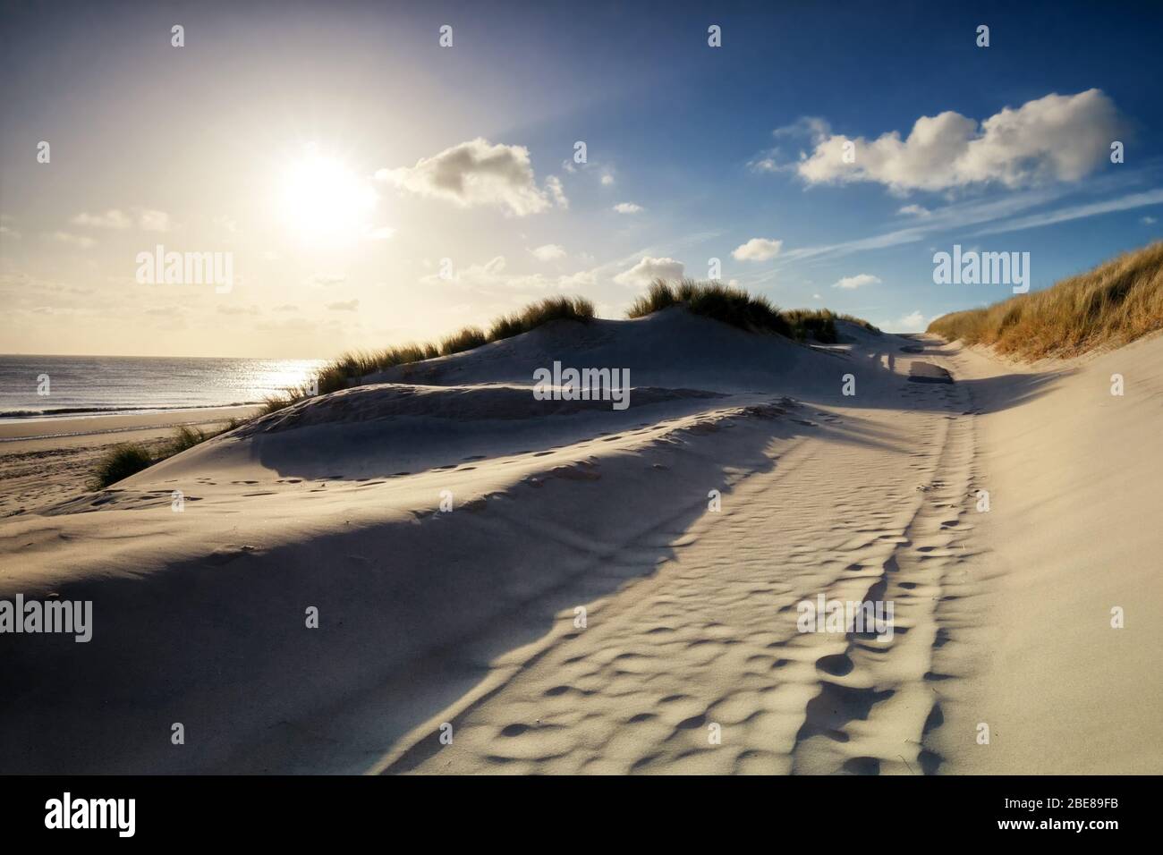 walking between sand dunes in sunshine Stock Photo - Alamy