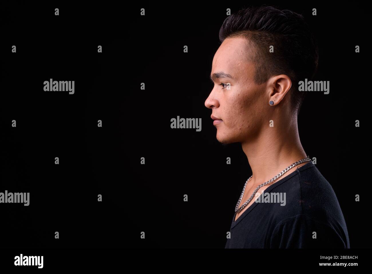 Closeup profile view of young handsome Indian man Stock Photo - Alamy