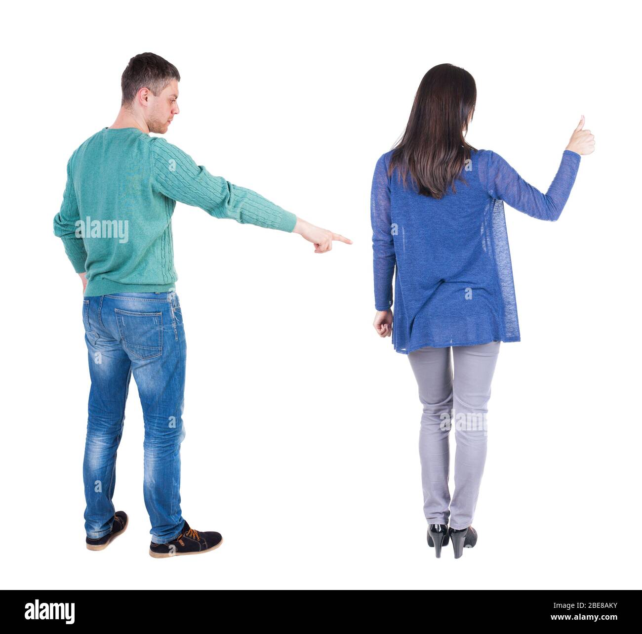 Back view of couple in sweater pointing. Rear view people collection ...
