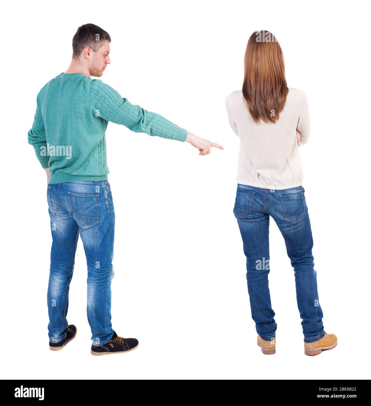 Back view of couple in sweater pointing. Rear view people collection ...
