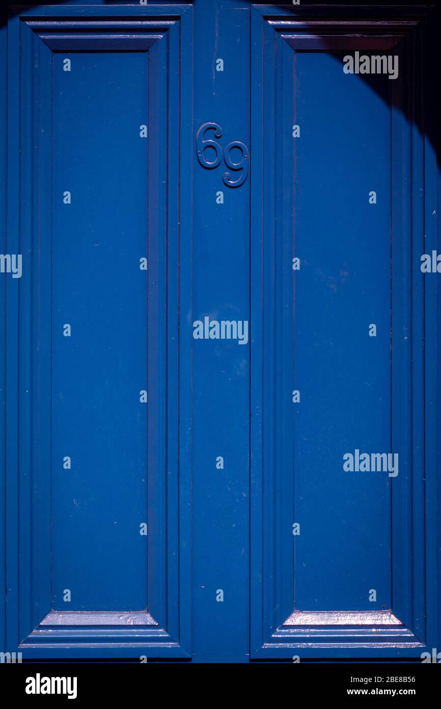 House number 69 - monochrome blue Stock Photo - Alamy