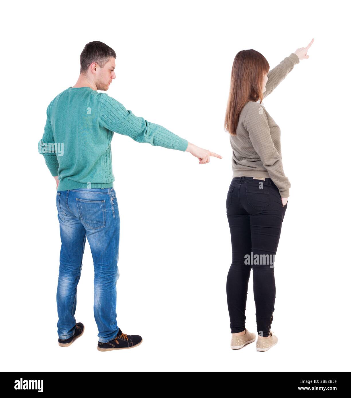 Back view of couple in sweater pointing. Rear view people collection ...