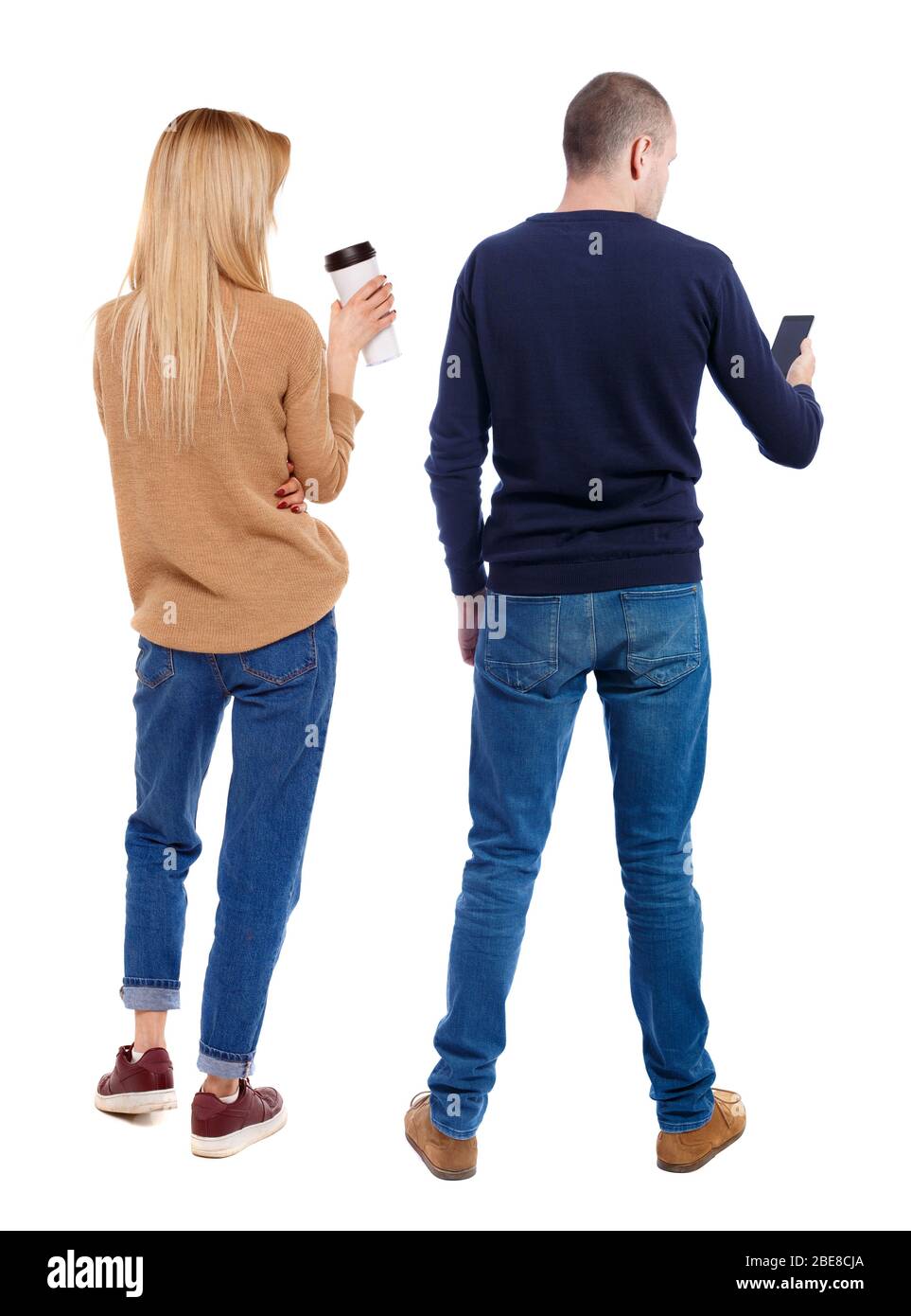 Back view of couple in sweater with mobile phone. beautiful friendly ...