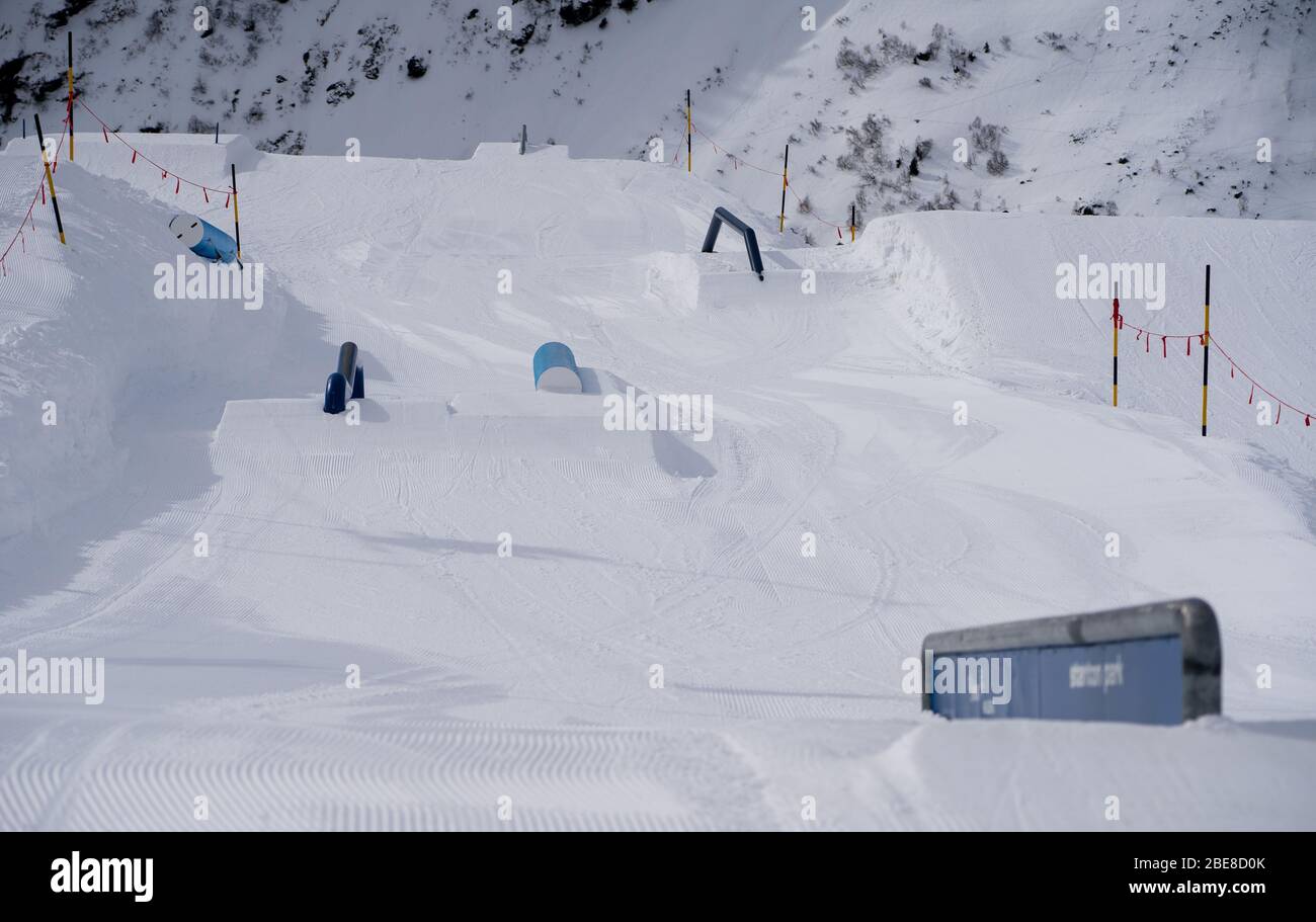 Perfectly shaped rail line with different obstacles in the snowpark of ...