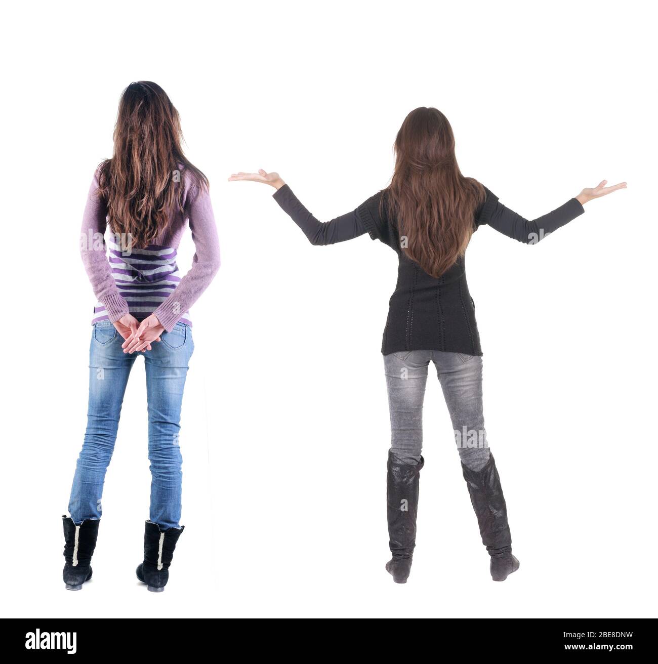 Back view of two woman in sweater. Rear view people collection ...