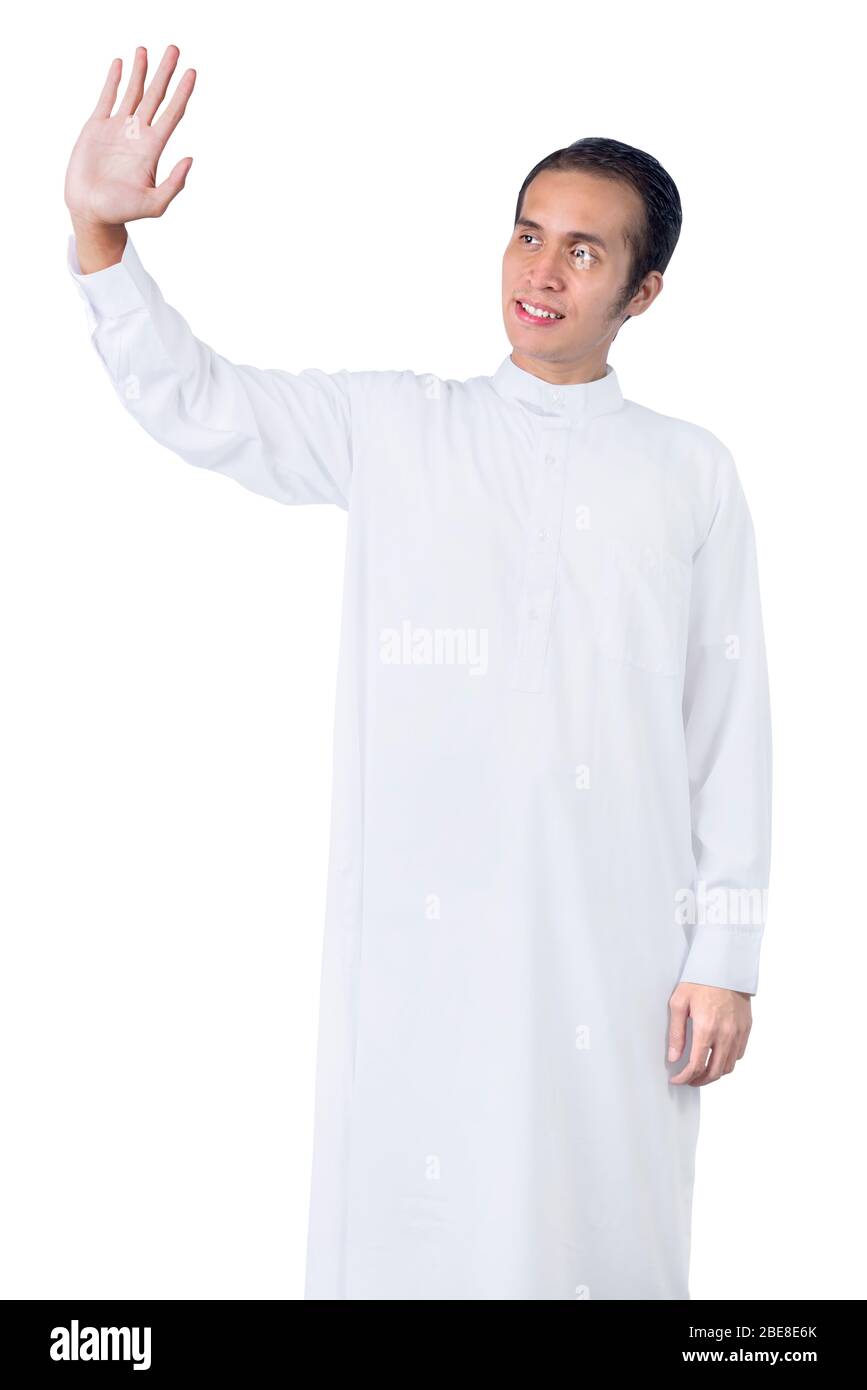 Asian Muslim man raised a hand and greeting isolated over white ...