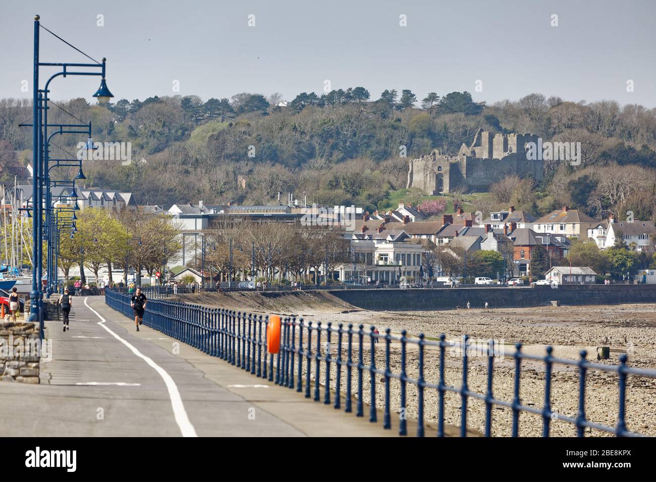Pictured: The almost deserted promenade in Mumbles, Swansea Bay, Wales ...