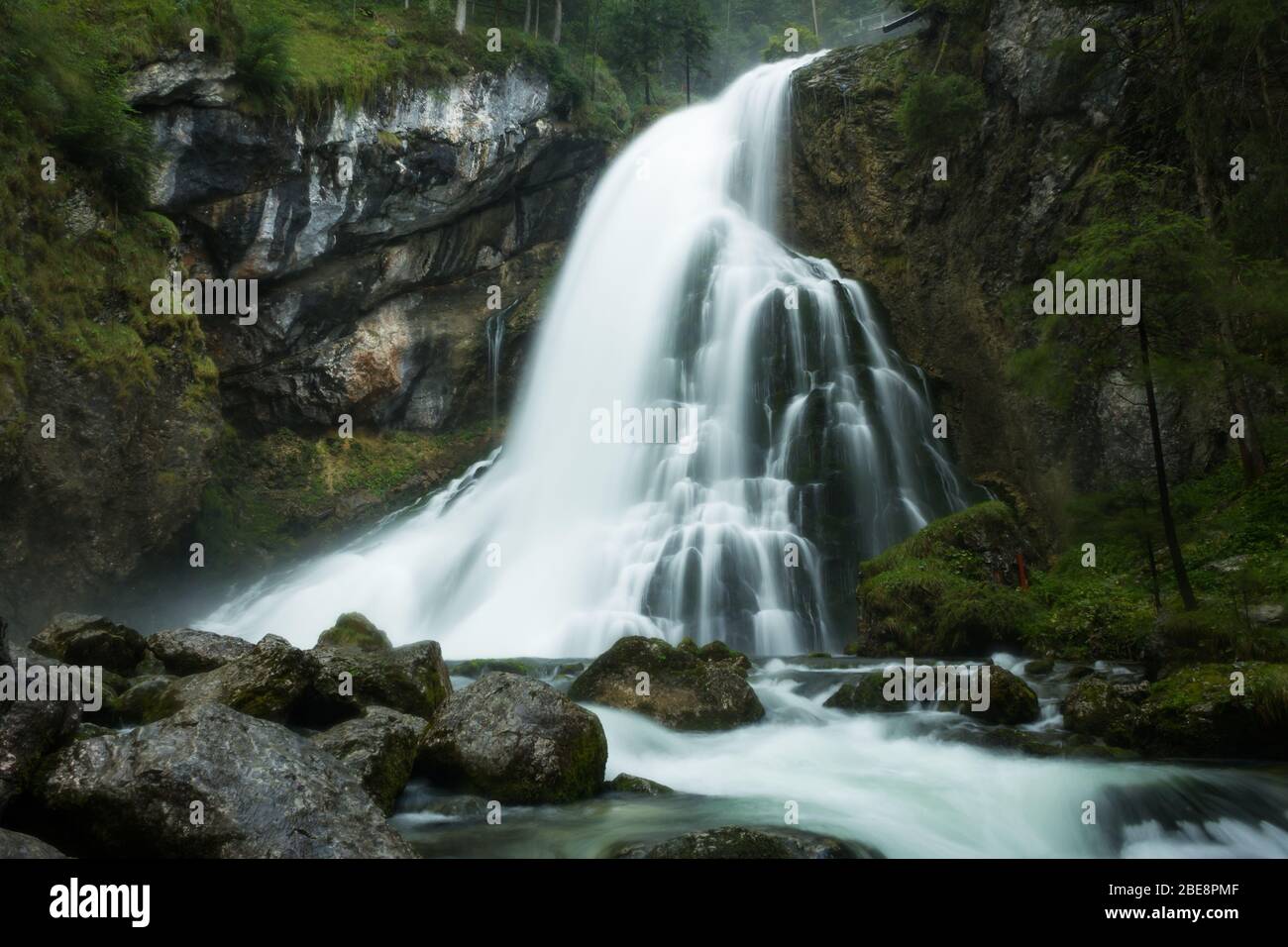 Picturesque dynamic waterfall scene in the Austrian alps at low angle ...