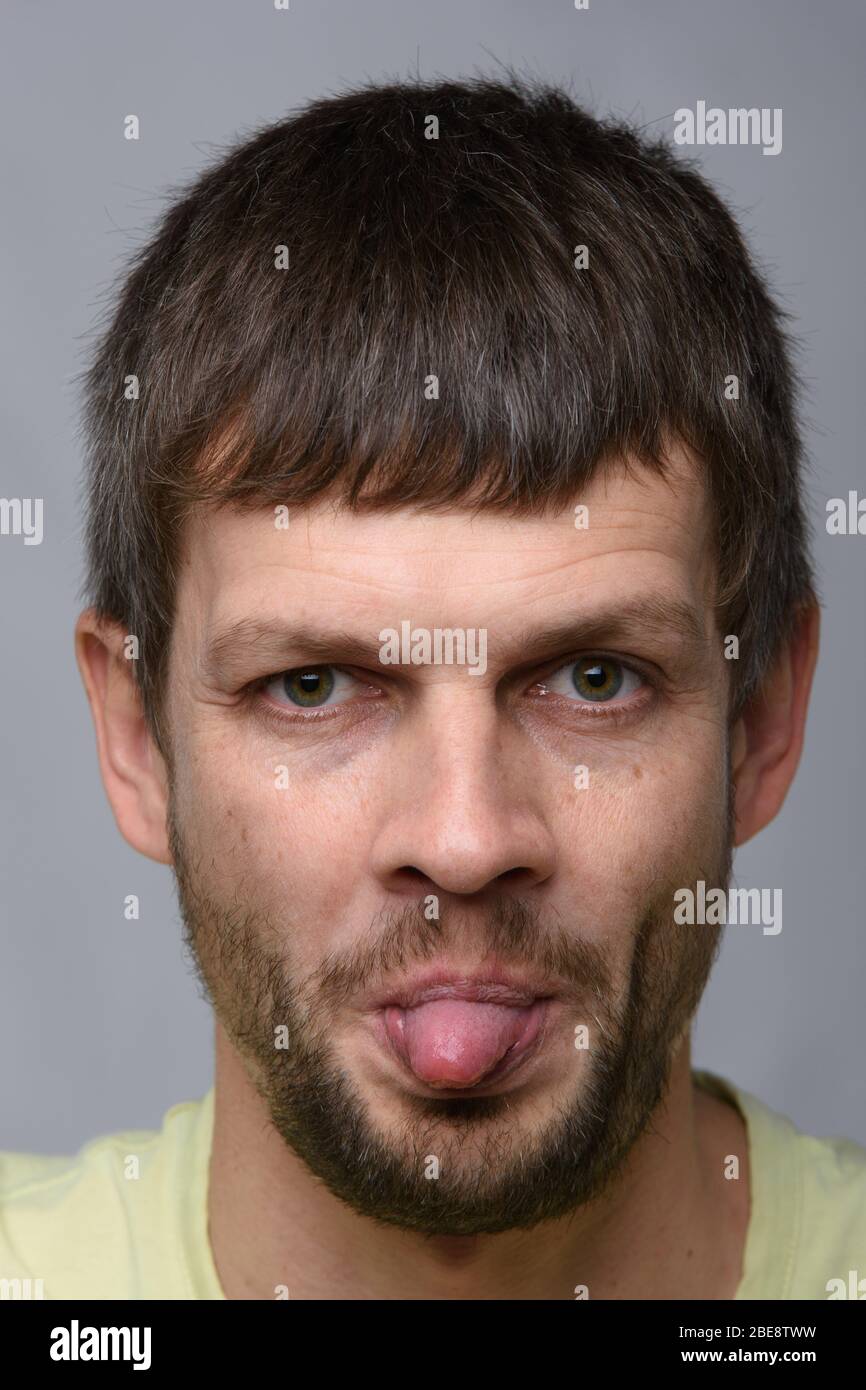 Teasing tongue man hi-res stock photography and images - Alamy
