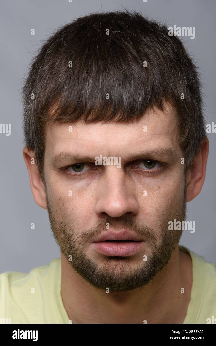 Close-up portrait of a gloomy man of European appearance Stock Photo ...