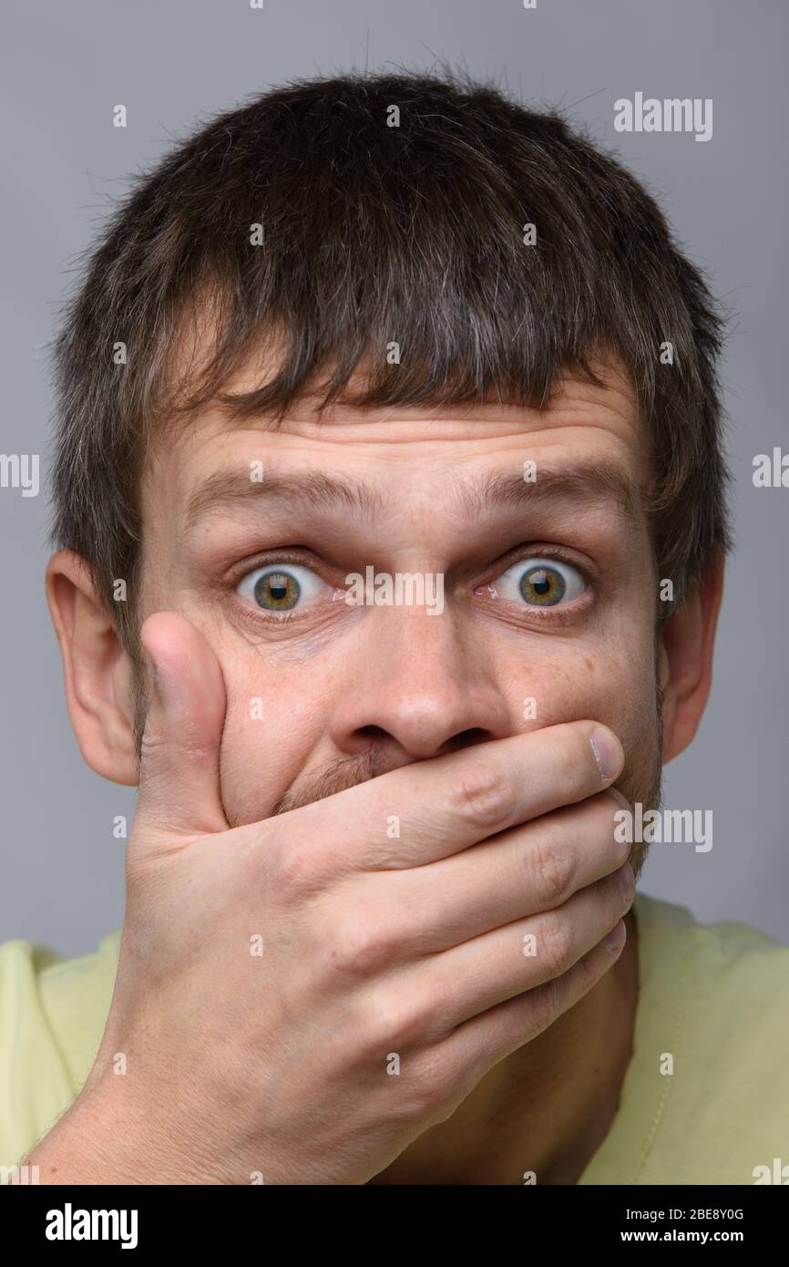 Close-up portrait of a man of European appearance, depicting a fright ...