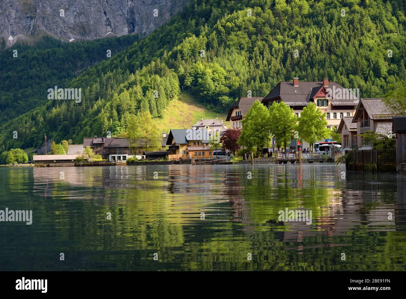 Scenic picture-postcard view of traditional old wooden houses in famous Hallstatt mountain ...