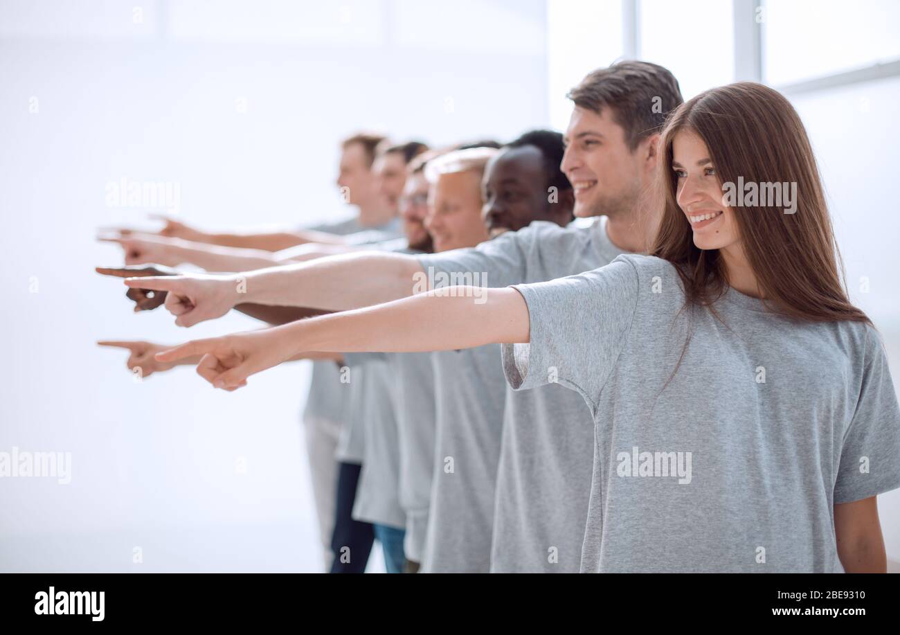 confident group of young men pointing ahead Stock Photo - Alamy