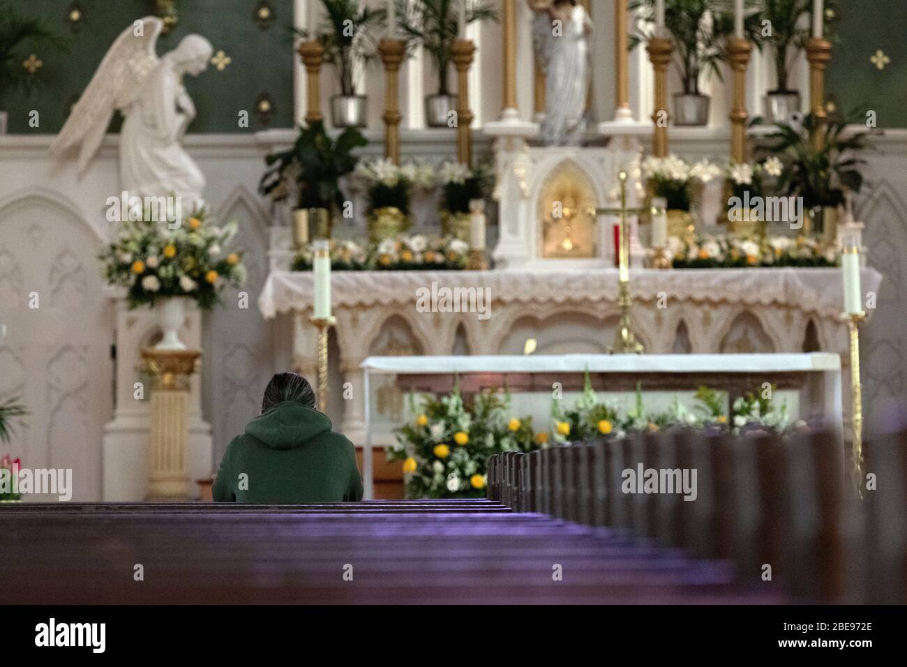 Person praying hi-res stock photography and images - Alamy