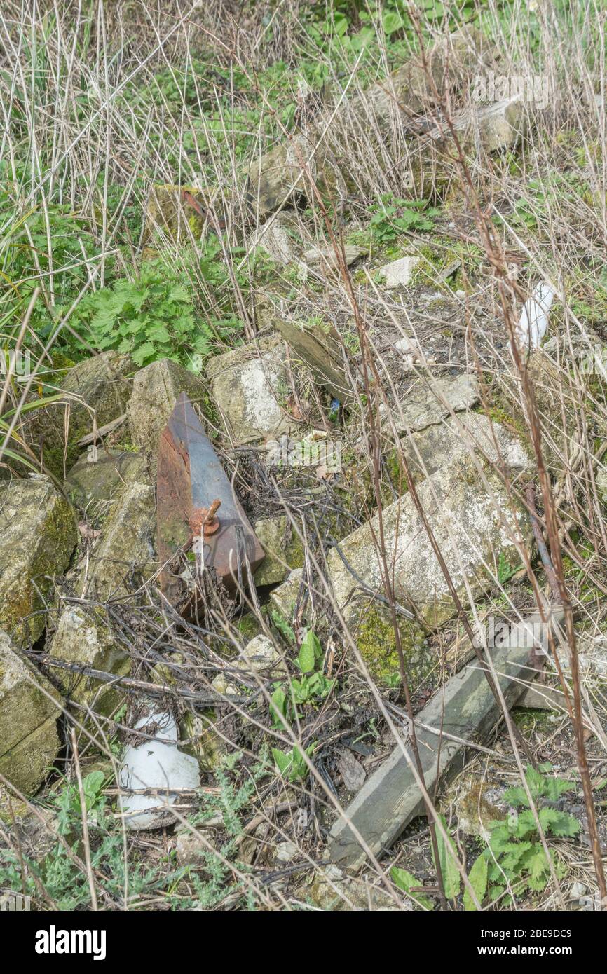 Pile of fly-tipped building rubble dumped in a rural setting Stock ...