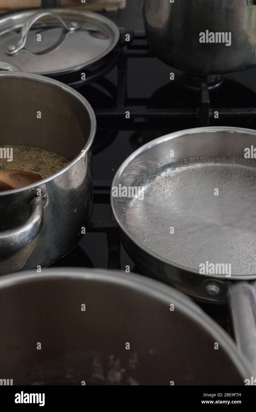 Pots with simmering water Stock Photo - Alamy