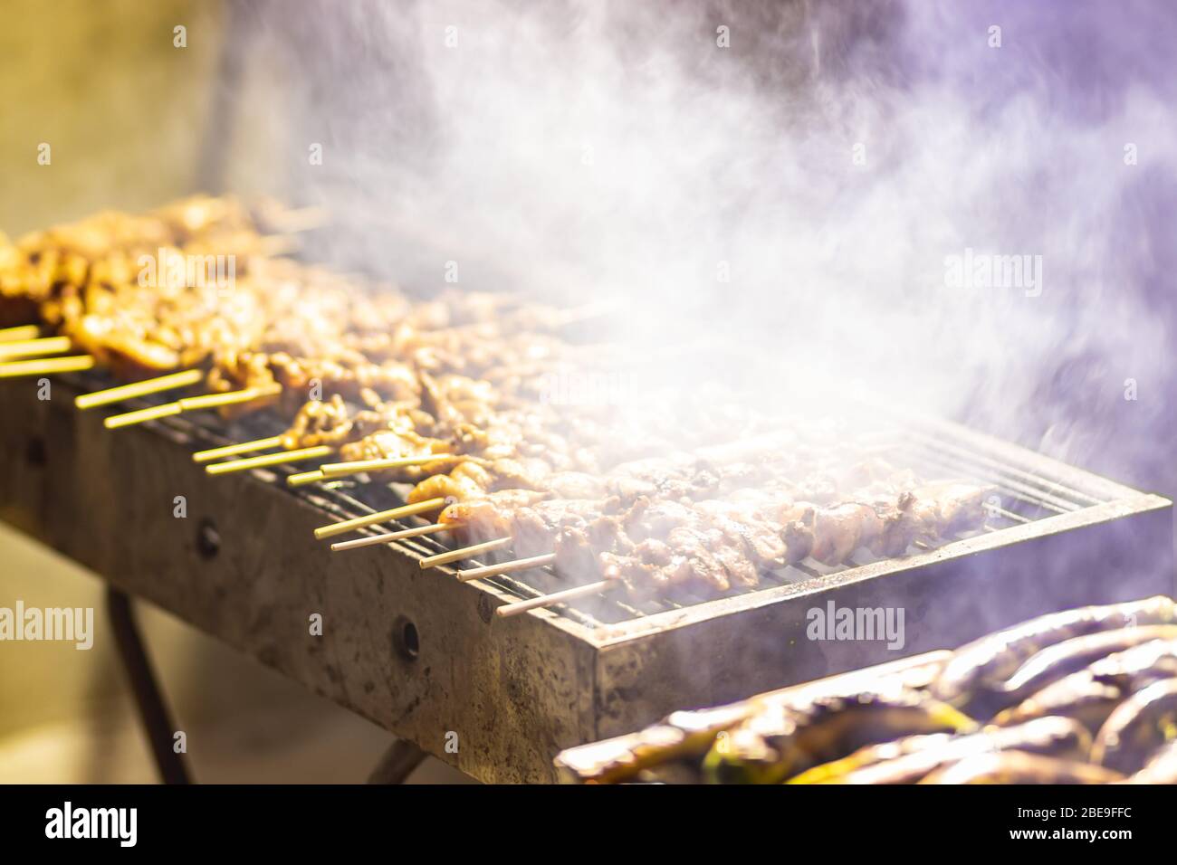 Chicken chunks skewers, grill, barbecue. On a metal bbq. In the ...