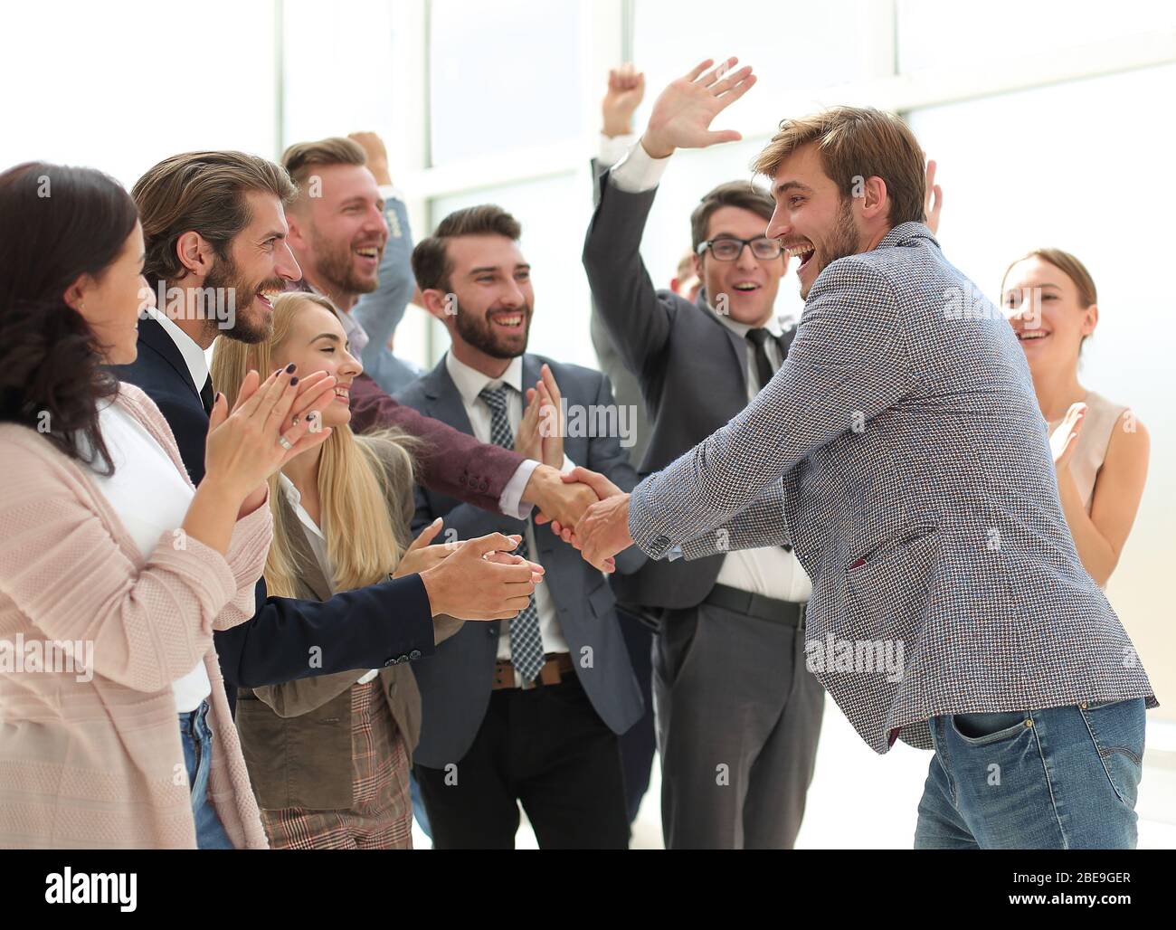 young business team welcoming their leader . success concept Stock ...