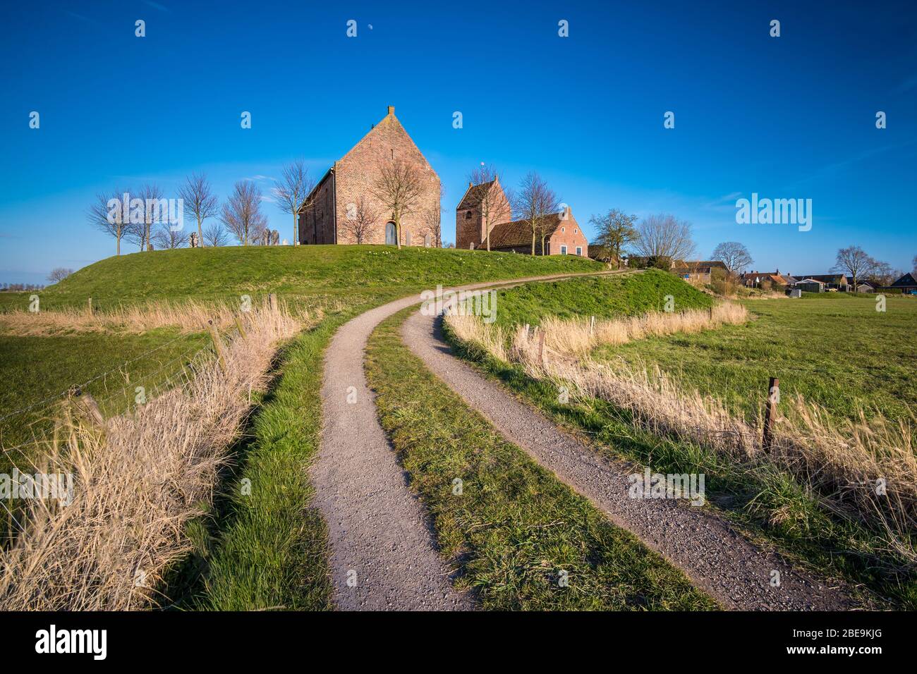 The historical medieval church of the small Dutch village of Ezinge ...