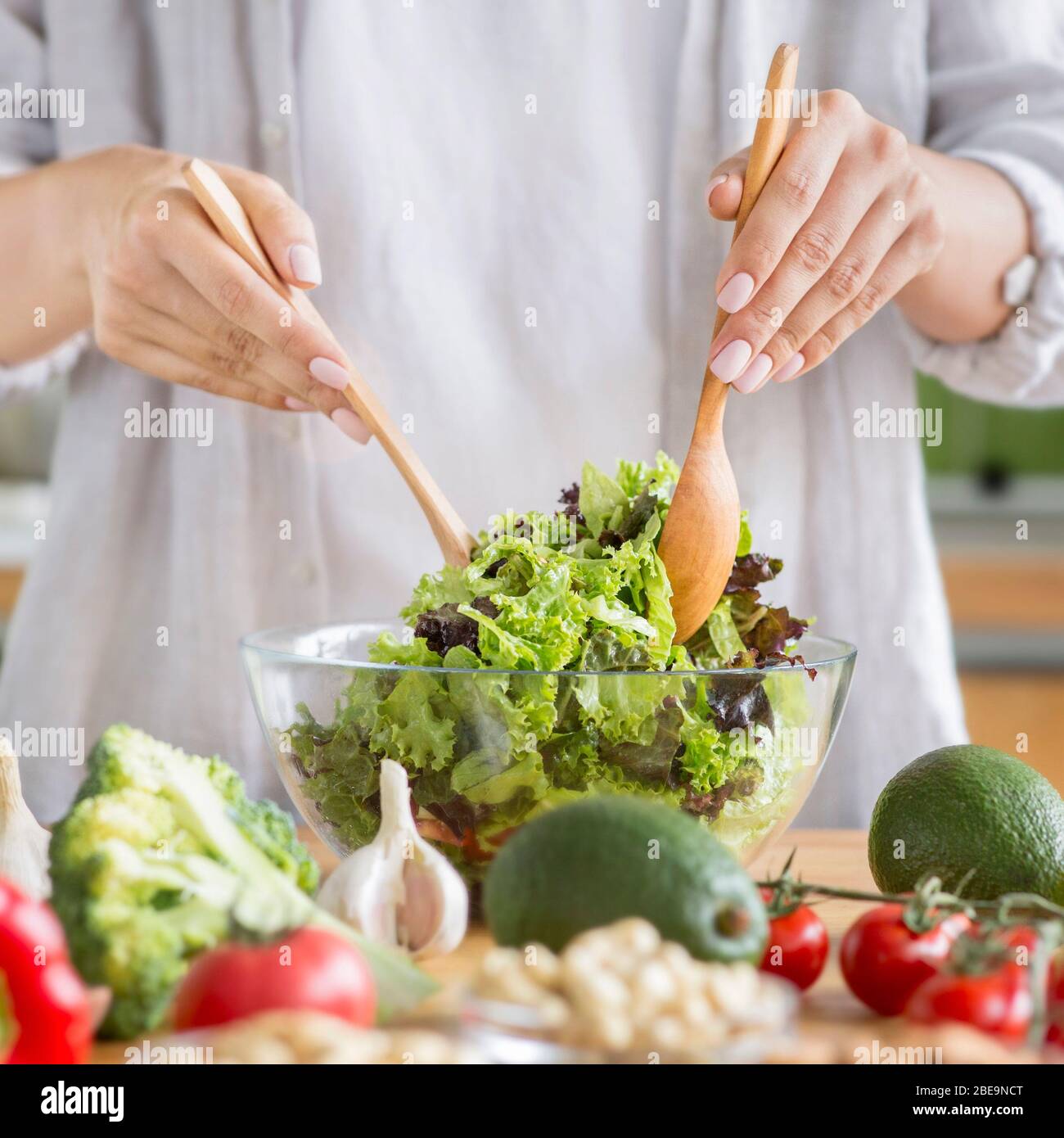 Woman mixing salad hi-res stock photography and images - Alamy