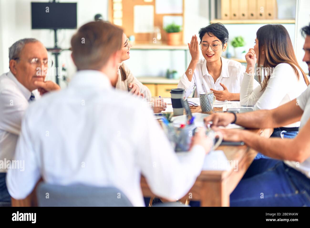 Group of business workers working together at the office Stock Photo ...