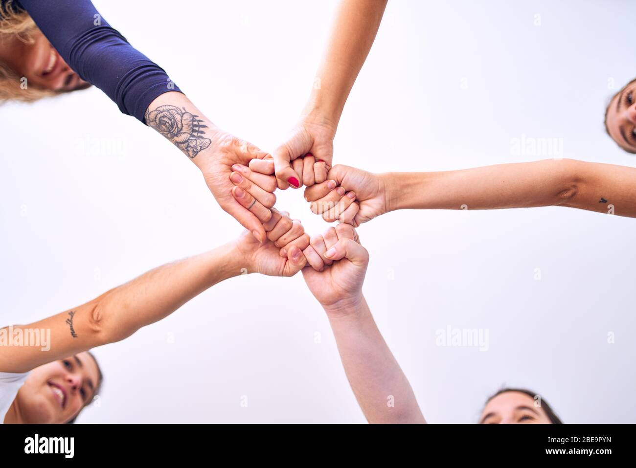 Young beautiful sportwomen doing gesture with hands Stock Photo - Alamy