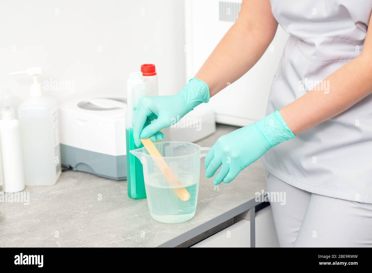 Medical worker hands preparing solution for ultrasonic disinfect ...