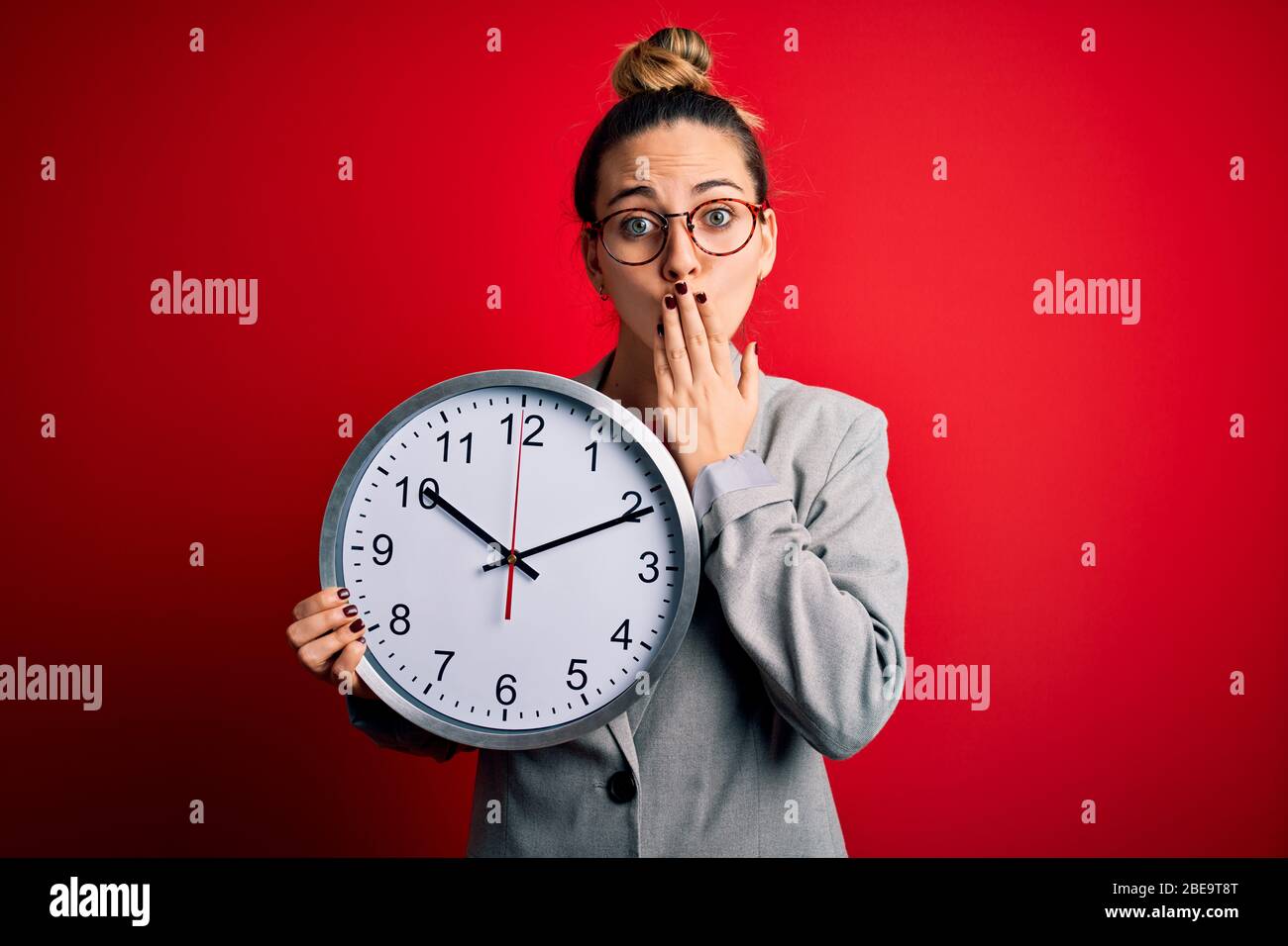 Beautiful blonde woman with blue eyes wearing glasses doing countdown ...
