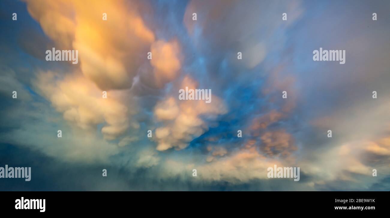Dramatic sky with thunderclouds. Pink Clouds Illuminated by the Rays of ...